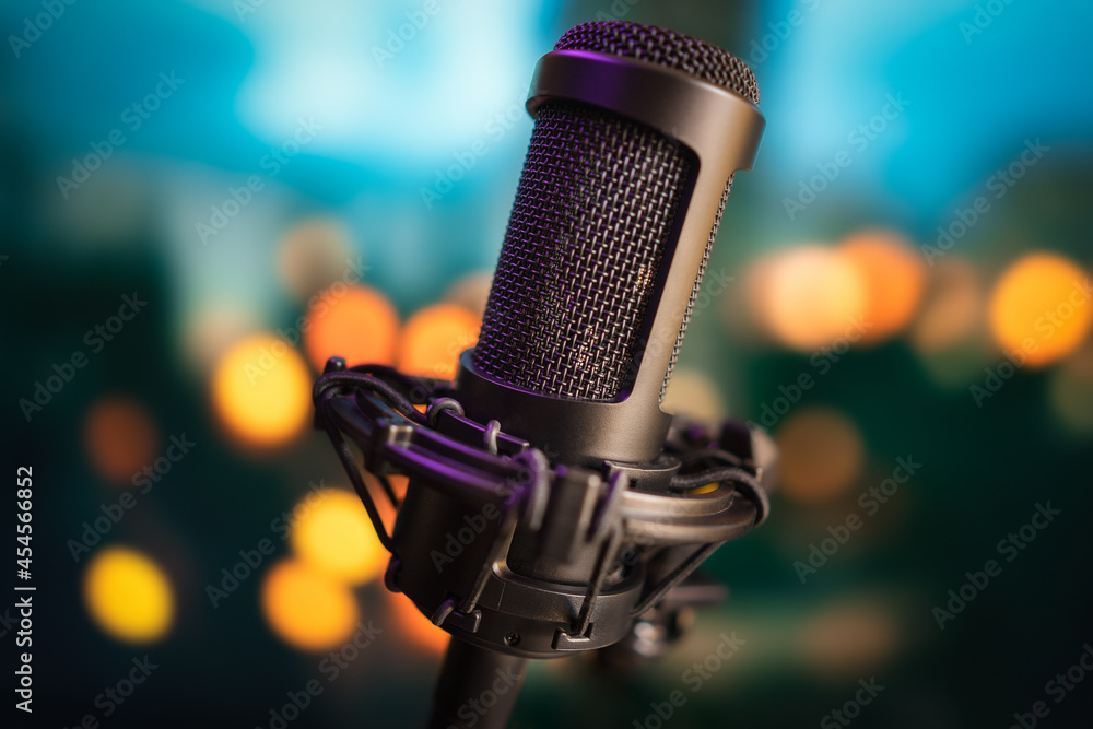 Professional studio microphone on blurred bokeh lights background for ...