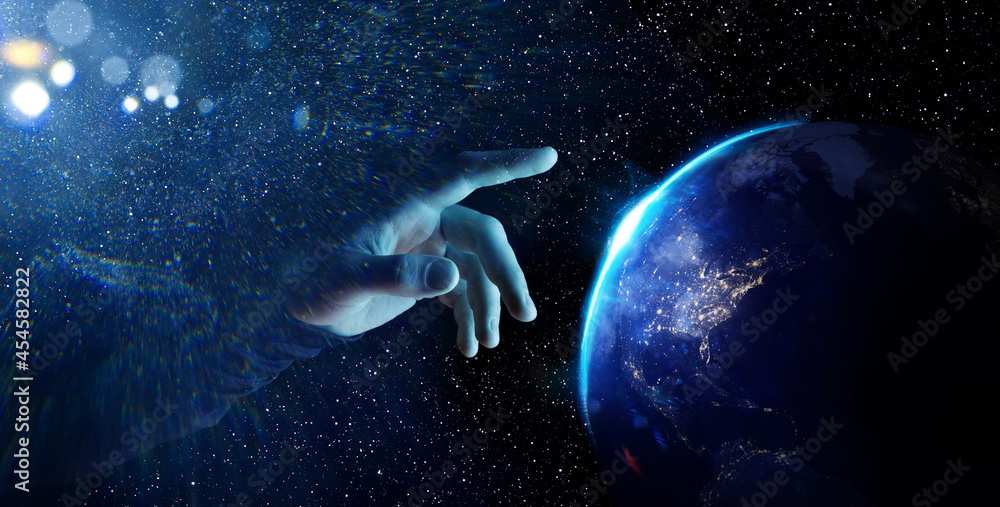 Abstract photo of hand touching planet earth. Planet Earth from space ...