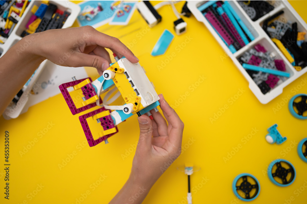 Minsk, Belarus. August, 2021. Teenager boy collects and programs the ...