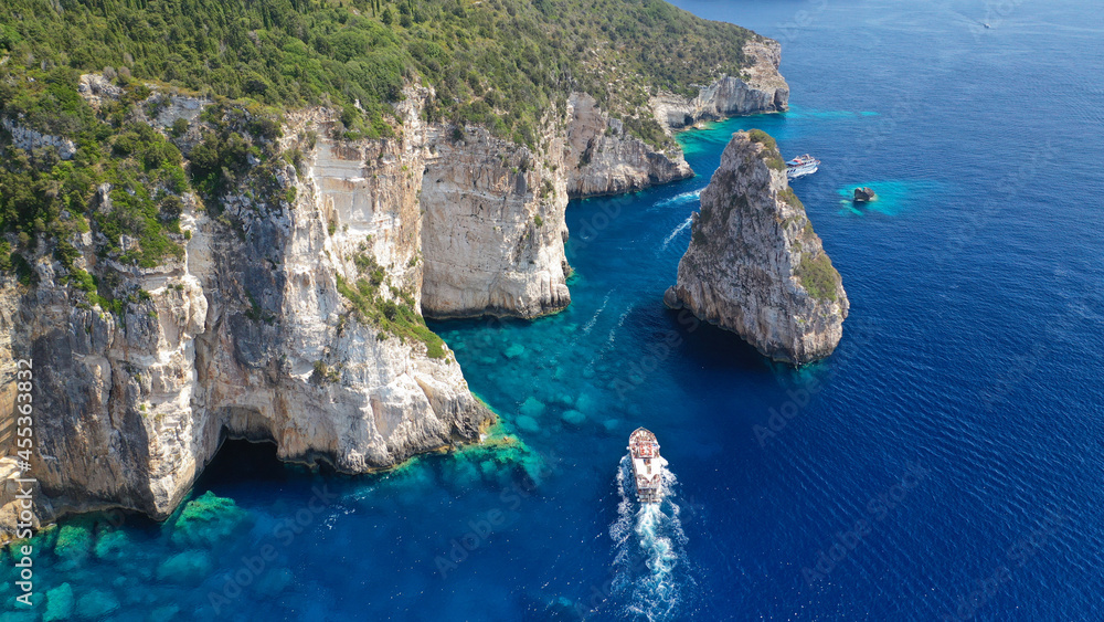 Aerial drone photo of iconic Ortholithos and azure caves with deep ...