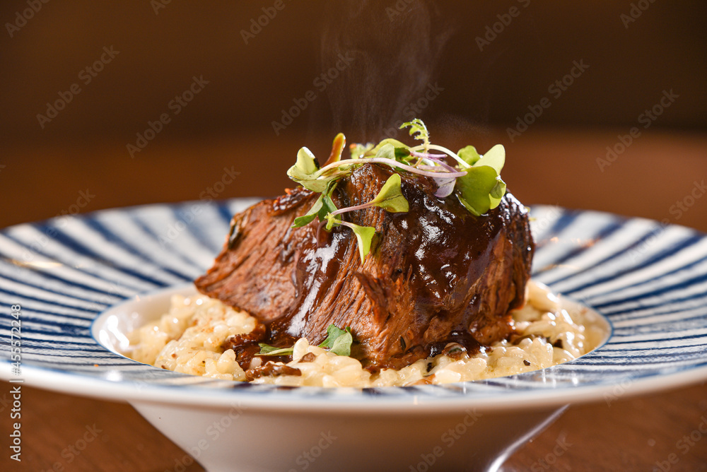 Foto Slow Braised Beef Short Ribs over Wild Mushroom Risotto do Stock ...