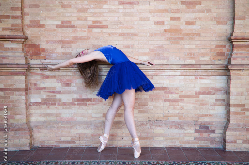 classical ballet dancer with turkey blue tutu doing different poses and ...