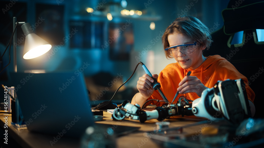 Smart Young Teenage Schoolboy is Studying Electronics and Soldering ...