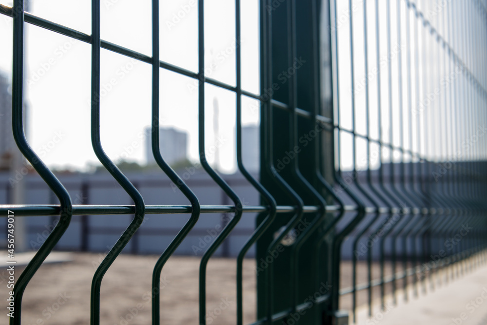 Steel lattice green fence with wire. Fencing. Grid industrial wire ...