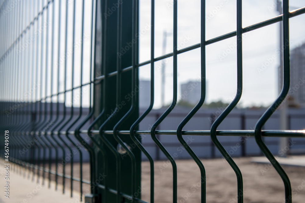 Steel lattice green fence with wire. Fencing. Grid industrial wire ...
