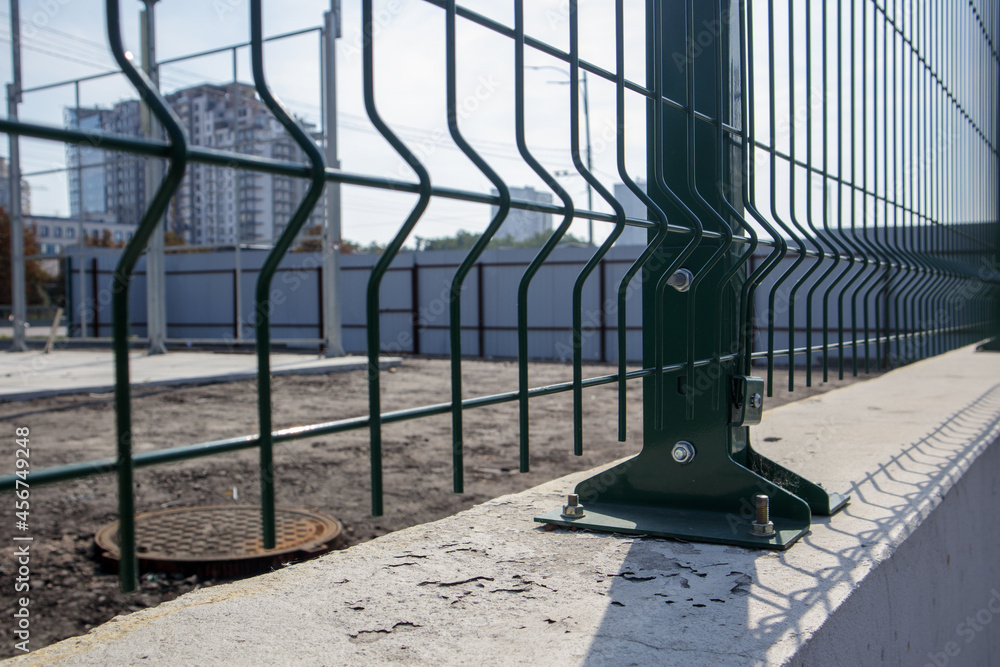 Steel lattice green fence with wire. Fencing. Grid industrial wire ...