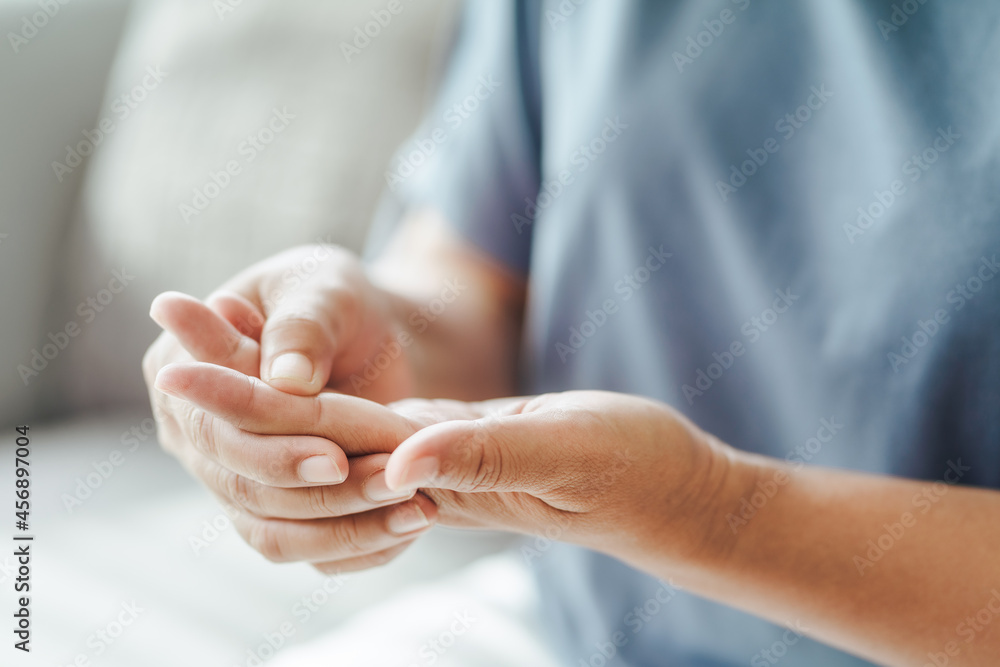 Woman suffering from hand and finger joint pain . Causes of rheumatoid ...