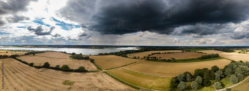 Aerial panoramic of the British countryside with a thunder storm ...