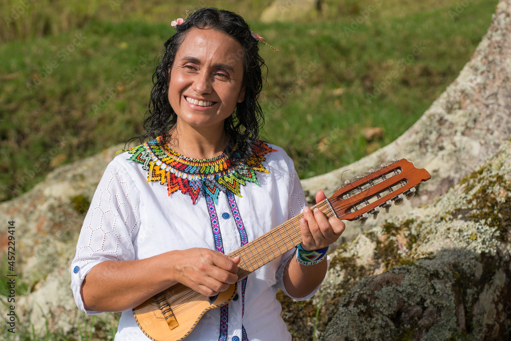 Indigenous woman with a musical instrument. new era of the indigenous ...