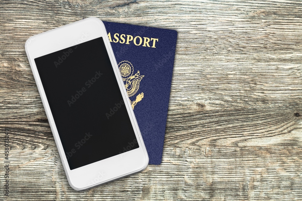 passport with a smartphone with a blank screen for digital vaccination ...