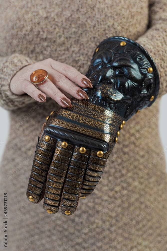 Medieval knightly brown plate gauntlet from Italian armor, in the form ...