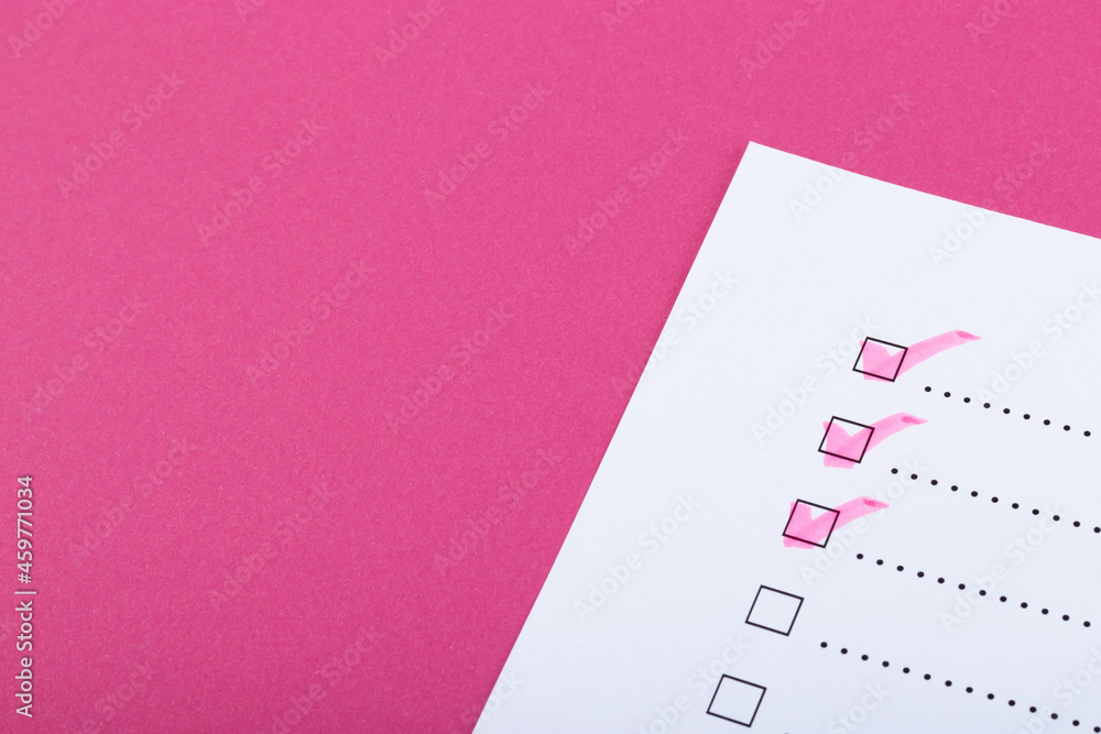Check list with pink marked points on pink background Stock Photo ...