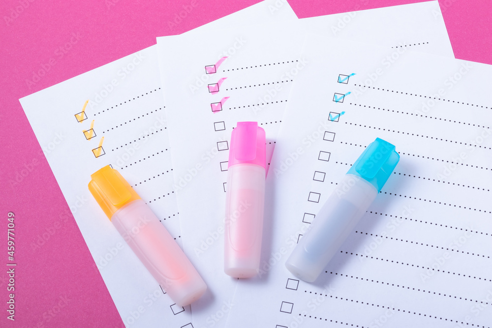Check list with pink, blue and orange marked points and markers on pink ...