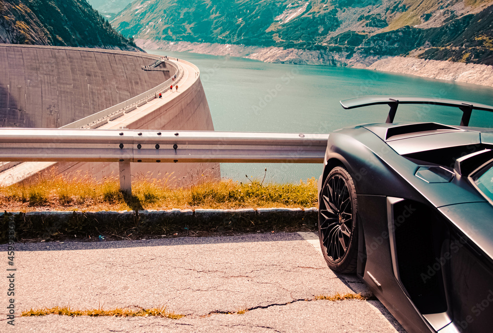 Beautiful alpine summer view with details of a famous super car at the ...