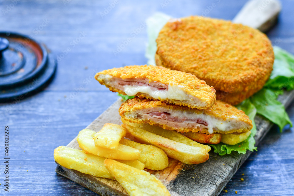 Crispy deep fried home made chicken Cordon bleu with cheese and ham and ...