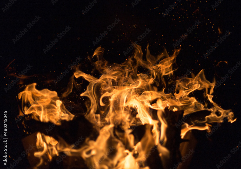 Fire creates endless shapes as it burns, flames and black backgrounds ...