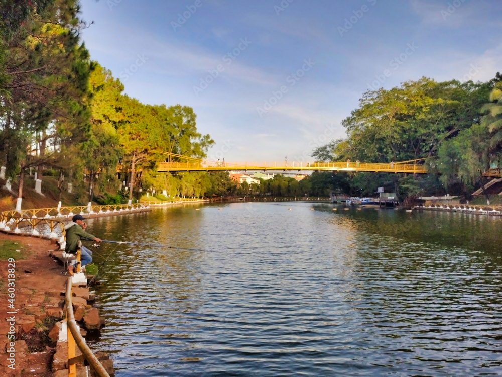 View of the Cầu Treo KDL Hồ Diên Hồng Bridge over the Hồ Đức An pond at ...