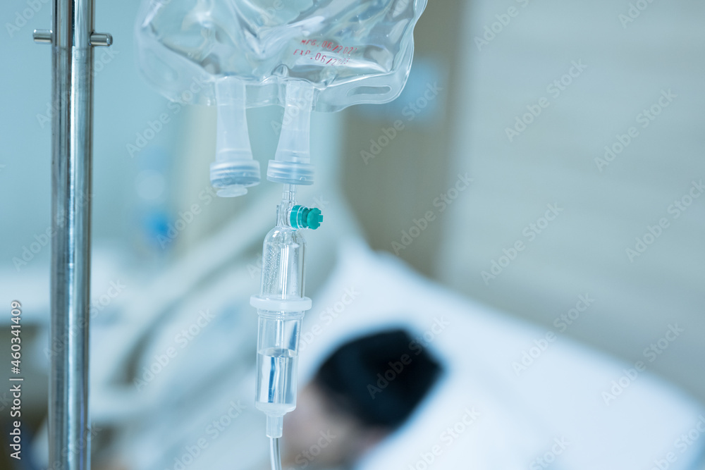 Close up set iv fluid intravenous drop saline drip and blurry sickness ...