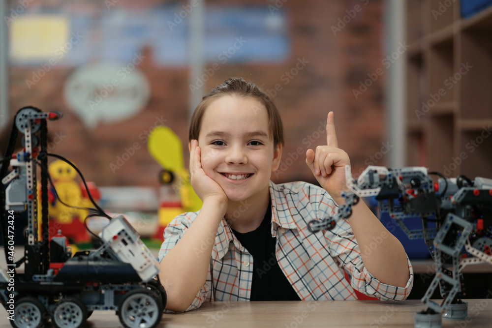 Foto de Stock Boy Works on a Fully Functional Programable Robot for His ...