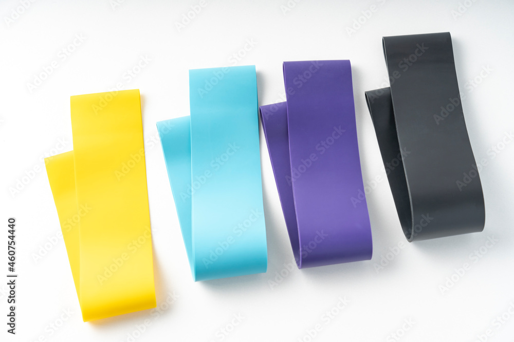Стоковое фото «A set of colorful elastic fitness band. Expanders for ...