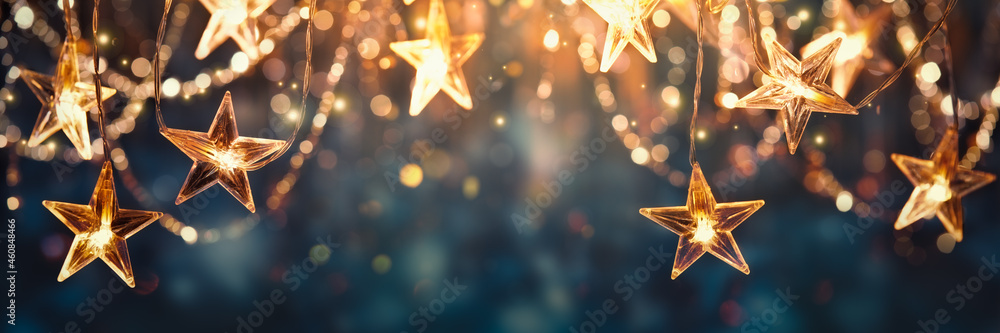 Gold star light hanging on dark background Stock Photo | Adobe Stock