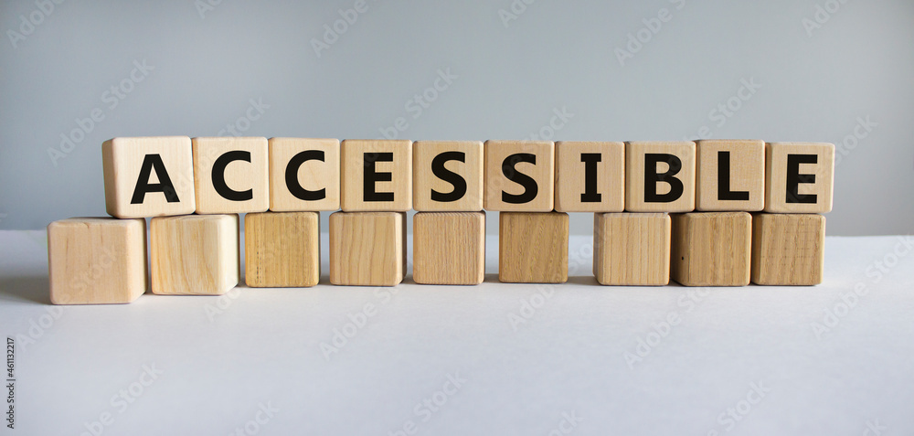 Accessible symbol. The word accessible on wooden cubes. Beautiful white ...