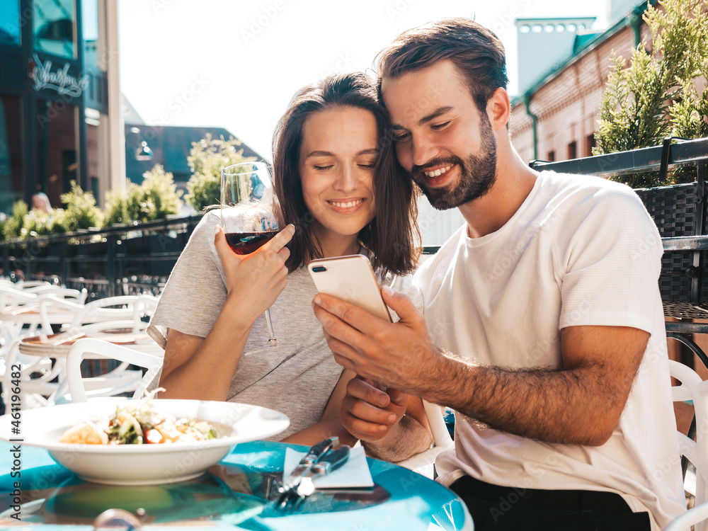 Smiling beautiful woman and her handsome boyfriend. Couple cheering ...