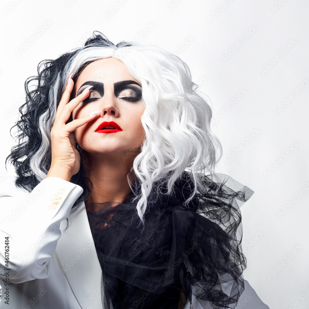 charismatic unusual woman in a black and white outfit with black and ...