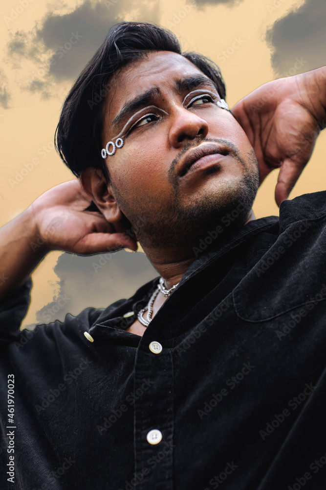 portrait of dark skinned Indian man on rooftop Stock Photo | Adobe Stock