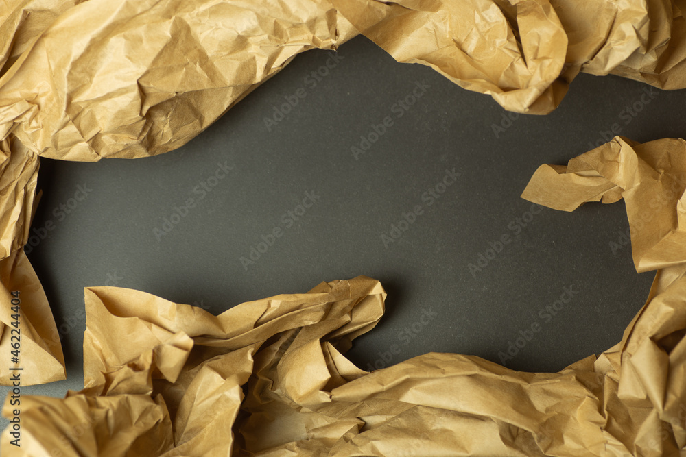 Paper padding material on dark stone background photographed in top ...