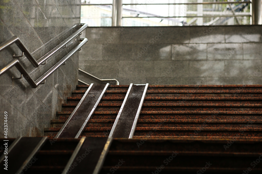 Pedestrian crossing staircase. Two handrails for wheelchairs. Metal ...