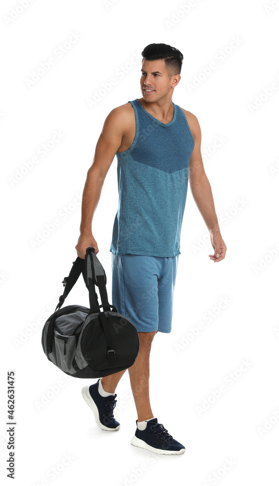 Handsome man with sports bag on white background Stock Photo | Adobe Stock
