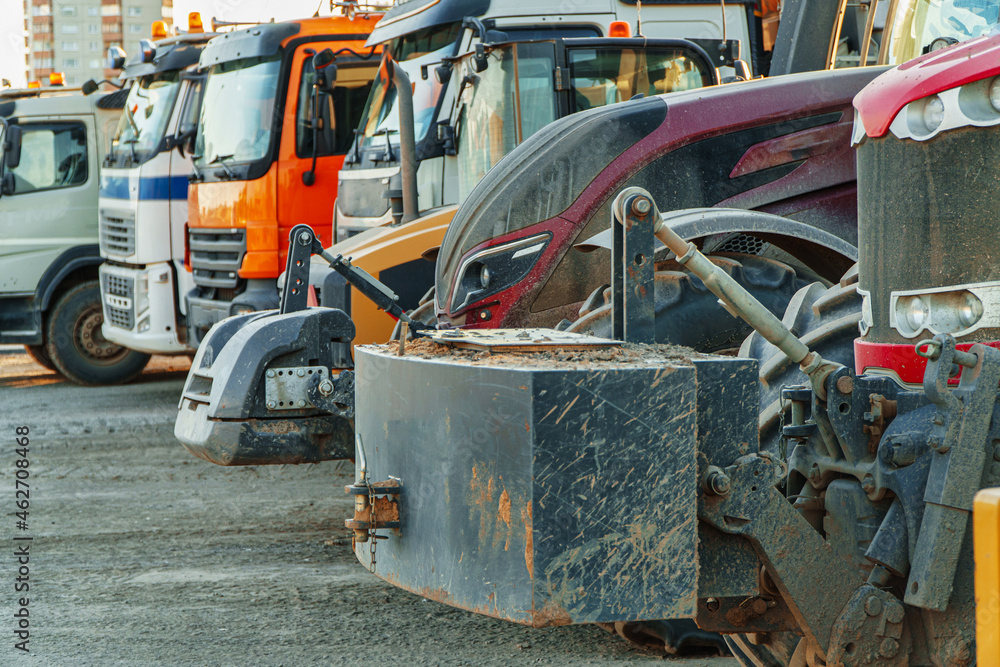 Road construction machinery in the parking lot. Trucks and tractors ...