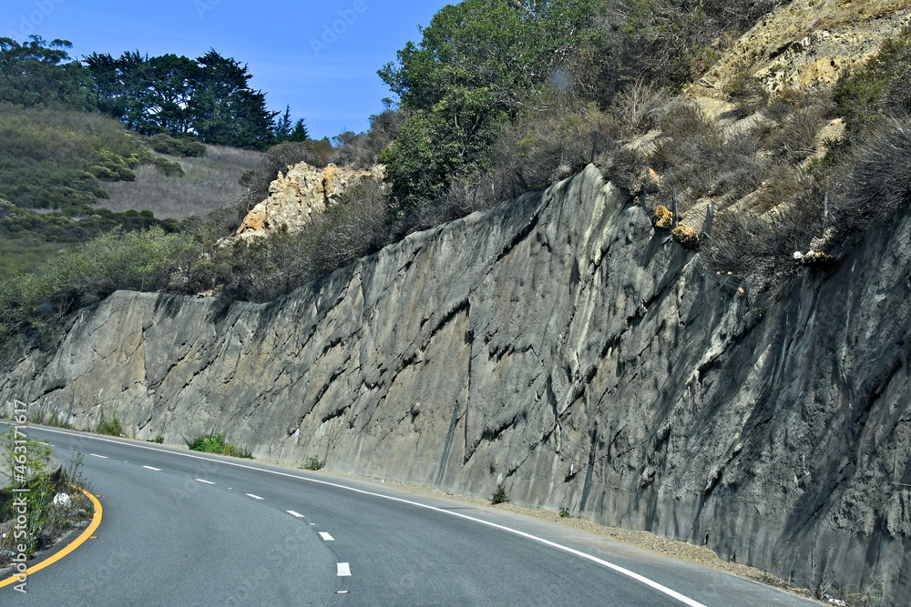 Natural looking road cut of reinforced concrete mitigates sliding and ...