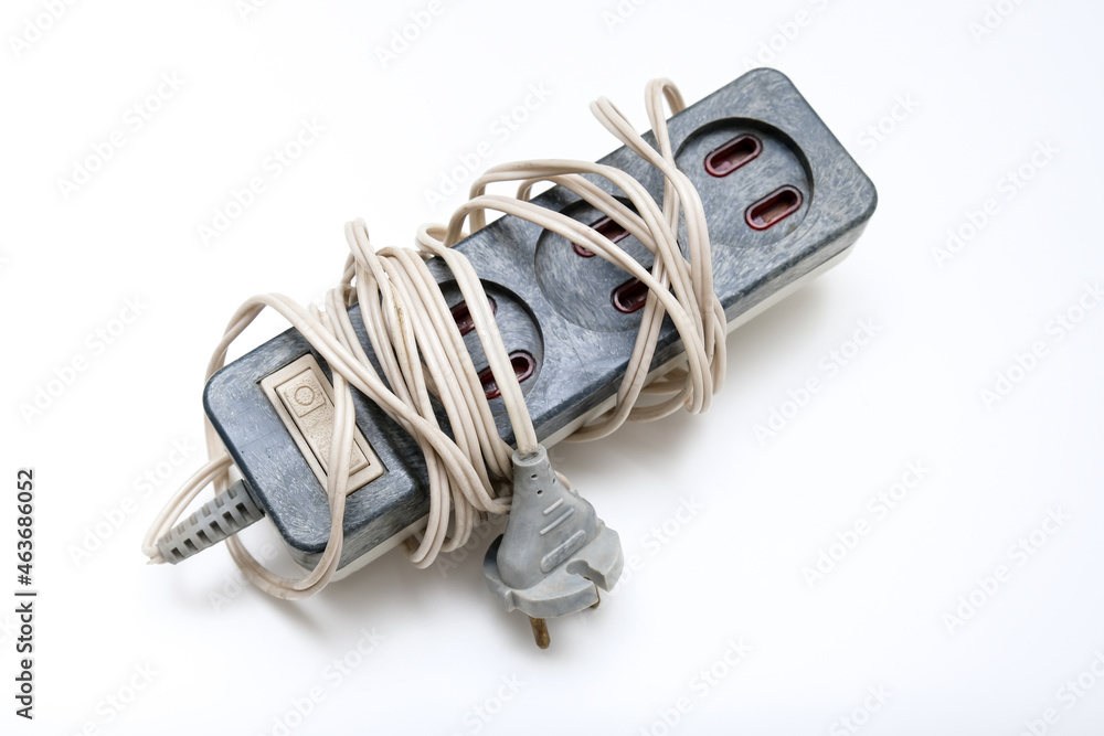 An old electrical power extension cable with european sockets and a ...