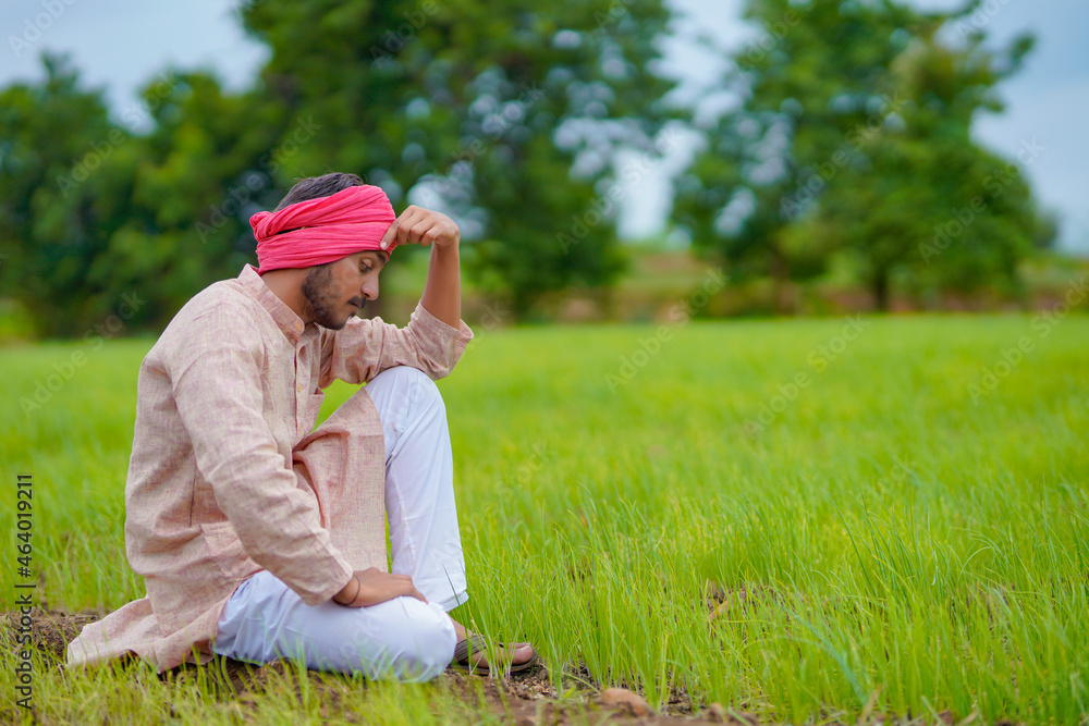 Young indian farmer in depression. Stock Photo | Adobe Stock