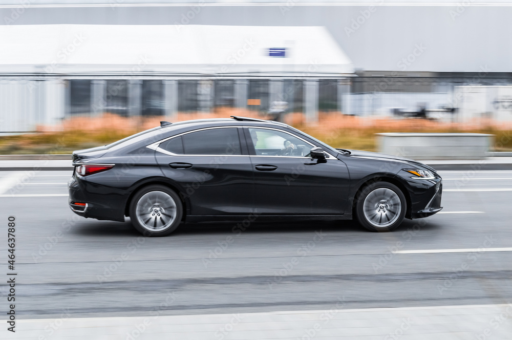 Black Lexus ES 350 in motion. Lexus seventh generation XZ10 driving at ...