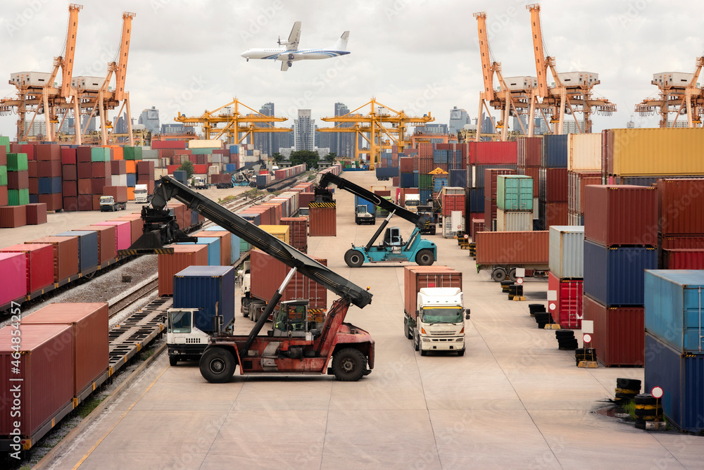 cargo plane flying above container dock and ship port use for ...