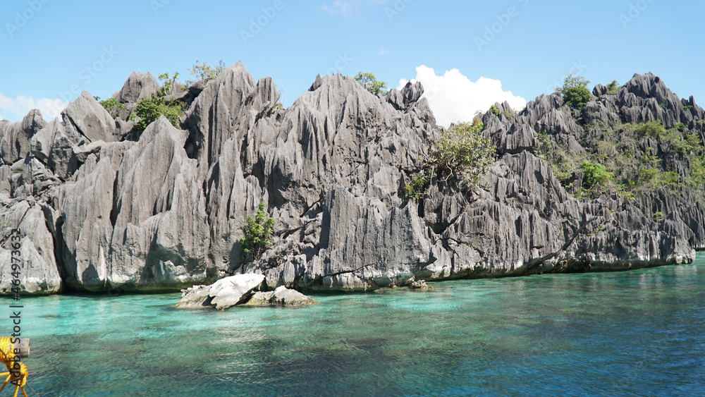Ocean and jagged rock landscapes with turquoise water at Coron Island ...