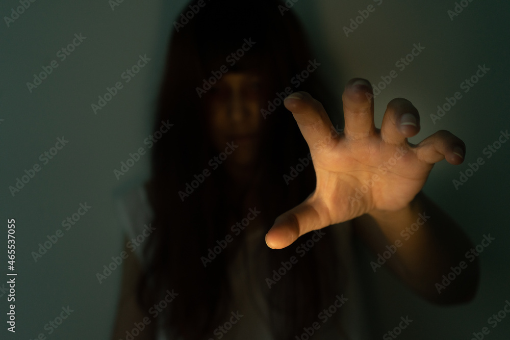 Female ghost in white dress in room. A young scary girl in an old white ...