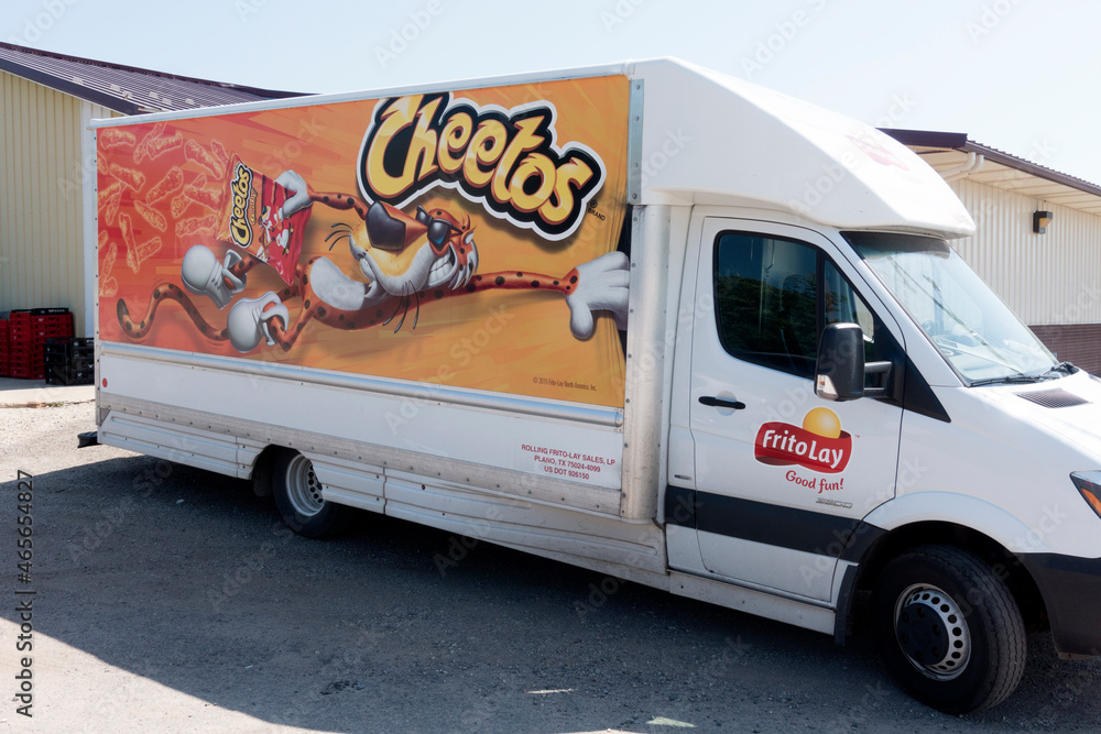 A Frito Lay Delivery truck with a life[-size picture of Chester Cheetah ...