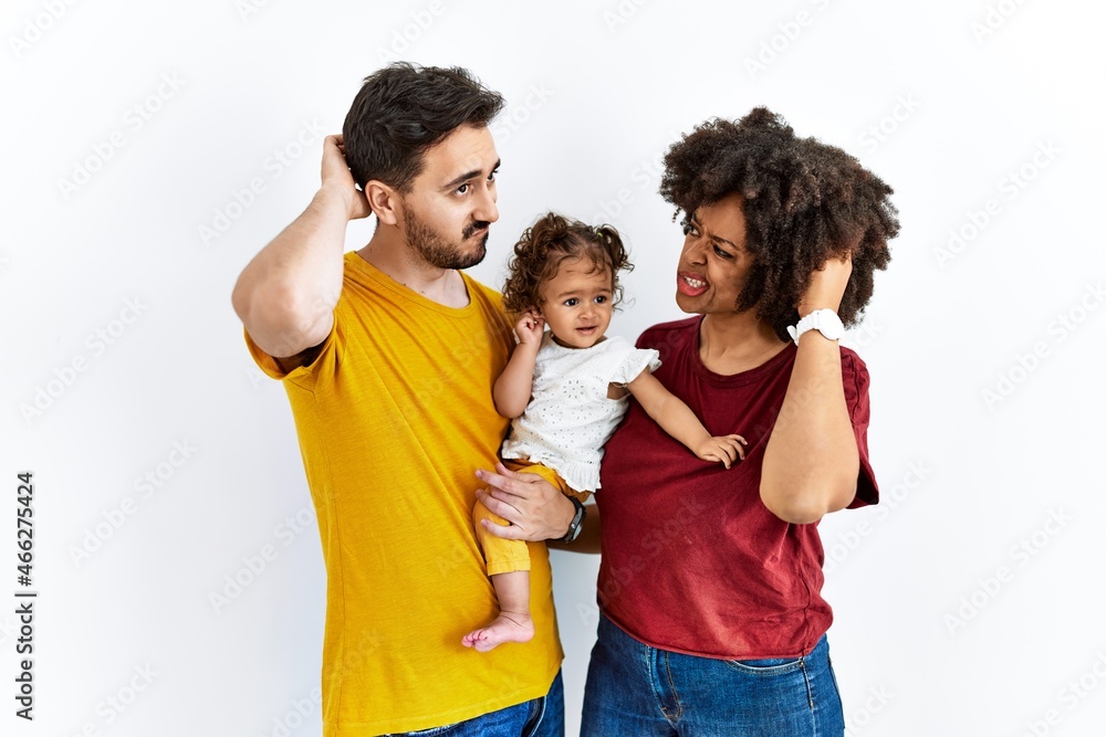 Interracial young family of black mother and hispanic father with ...