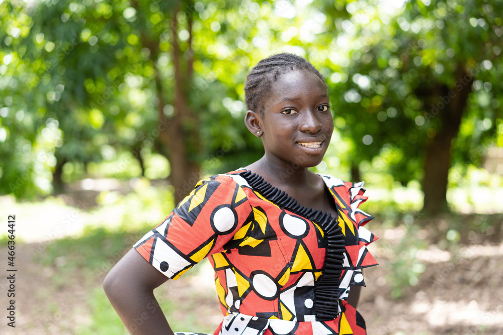 Beautiful black African teenage girl without headgear, wearing a ...