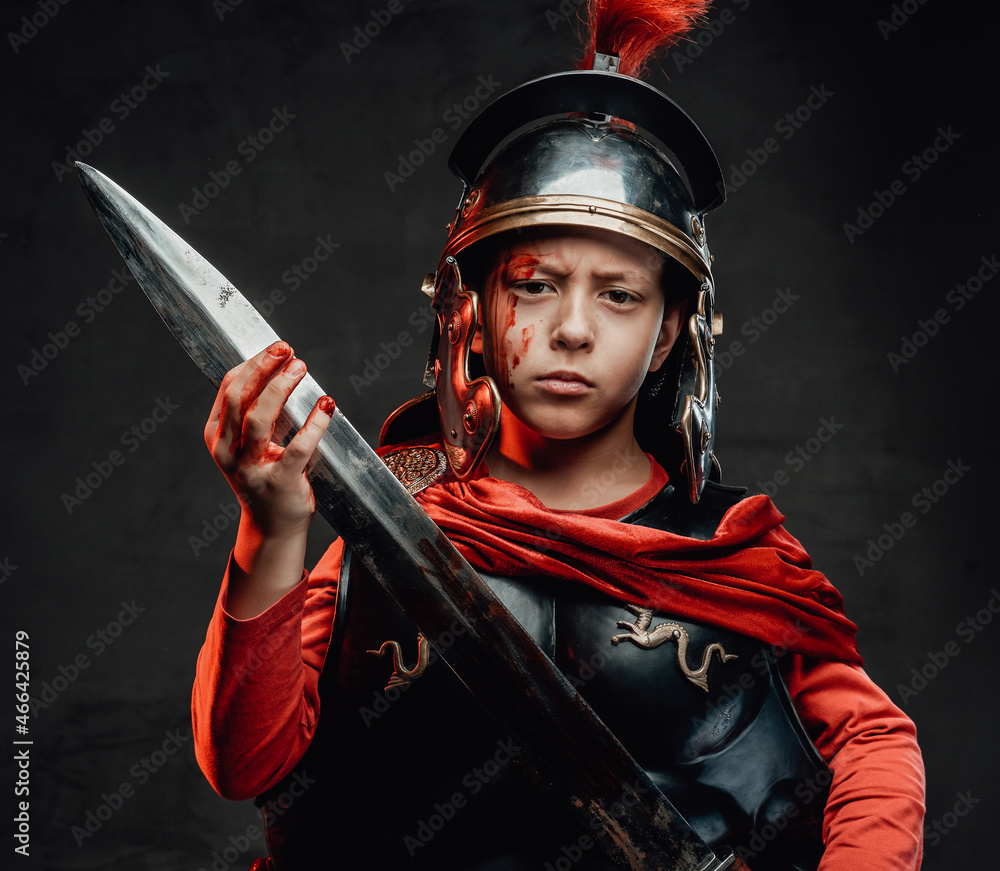 Angry roman little soldier with sword in dark background Stock Photo ...