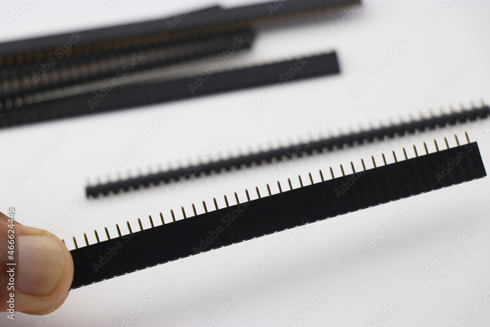 Female header pins in a single row held in hand, Connectors used in ...