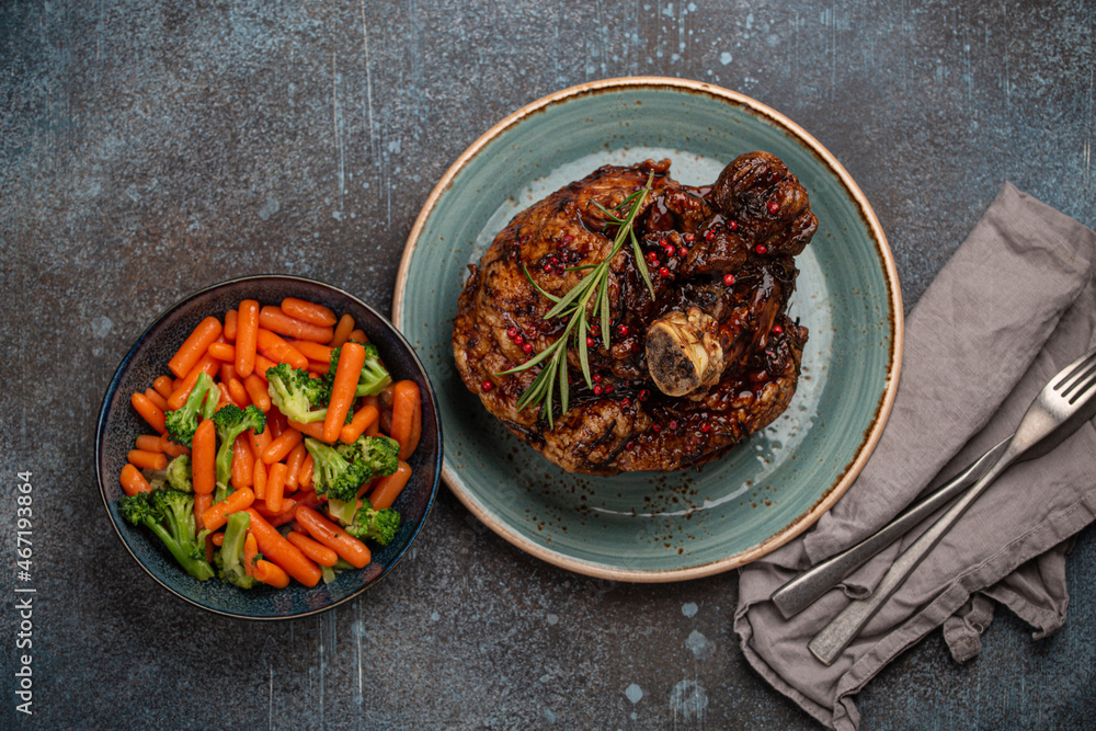 Delicious roasted ham or pork knuckle with glazed brown crispy skin ...