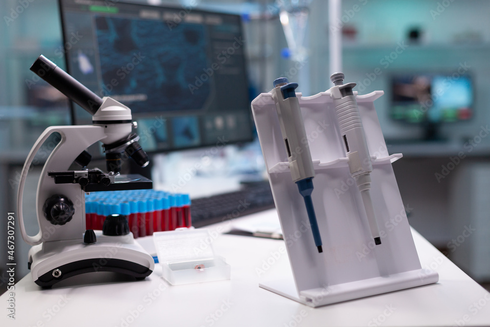 Nobody in research laboratory with micro pipette on desk. Empty ...