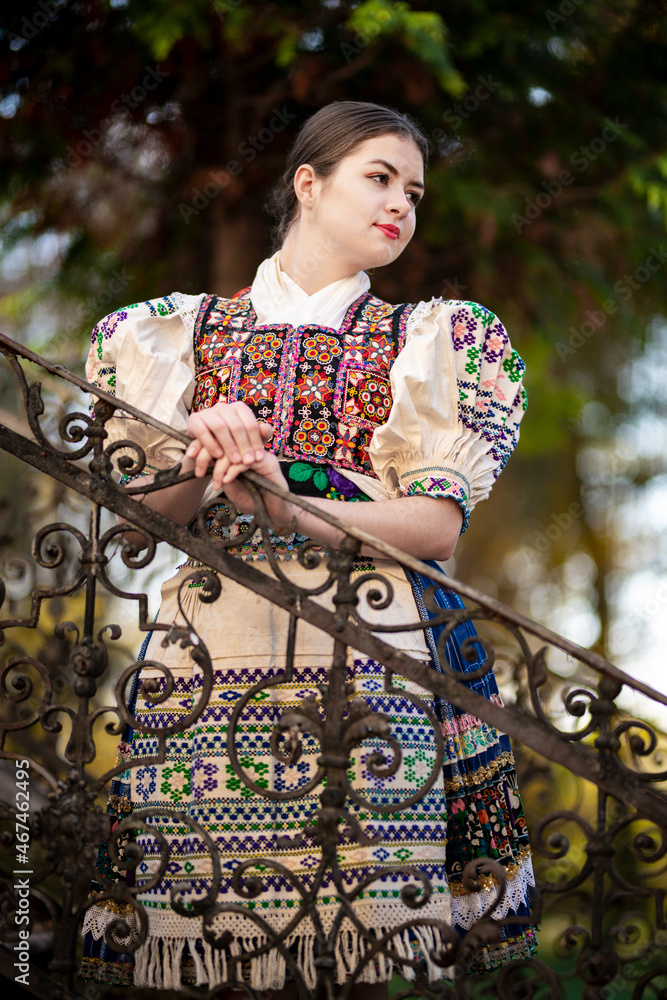 Young beautiful slovak woman in traditional dress. Slovak folklore ...
