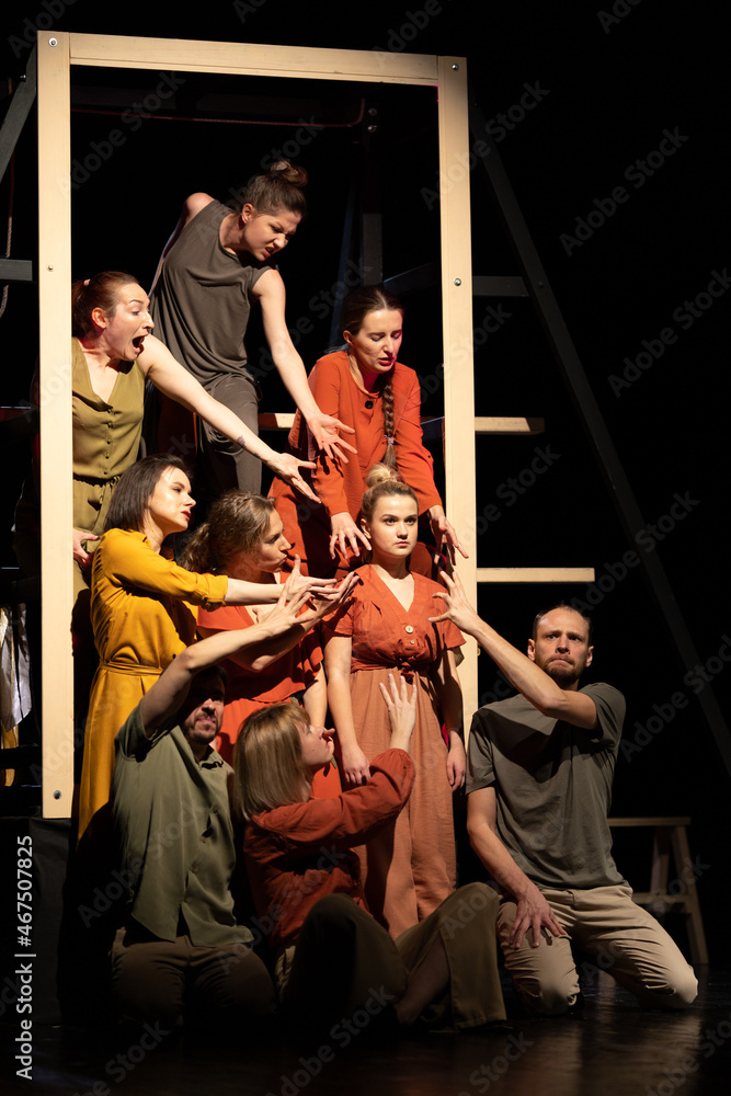 Actors and actresses perform a modern performance on the stage of the ...