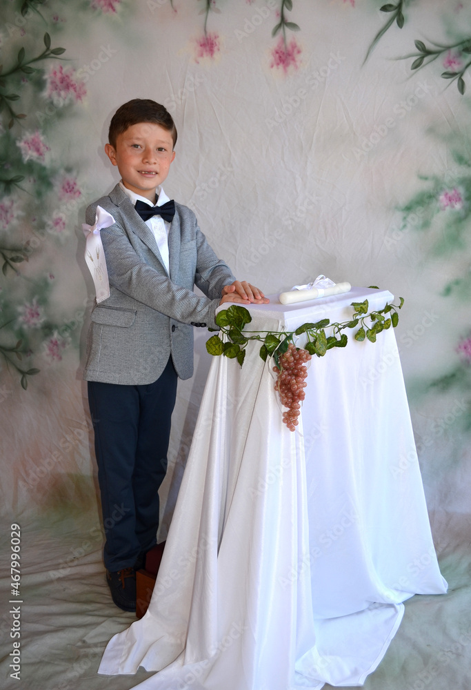 Boy celebrating his first holy communion Stock Photo | Adobe Stock